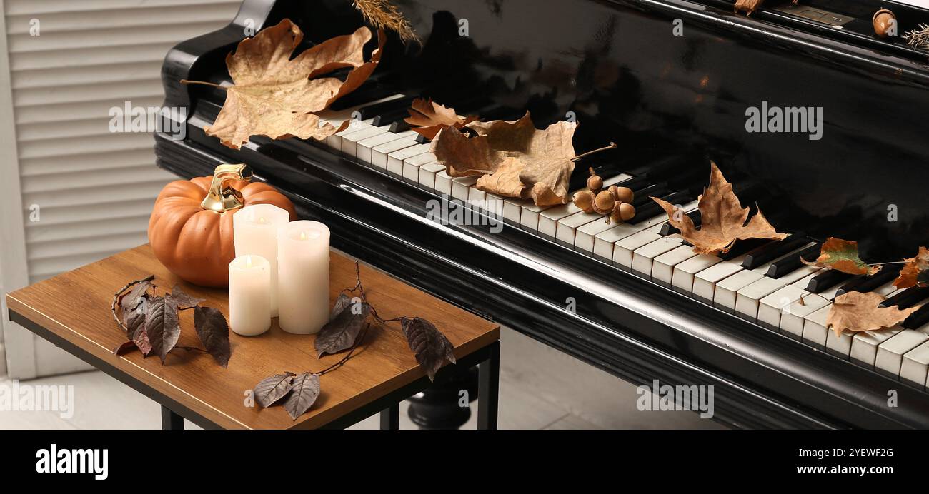 Grand piano with autumn decorations in room Stock Photo - Alamy
