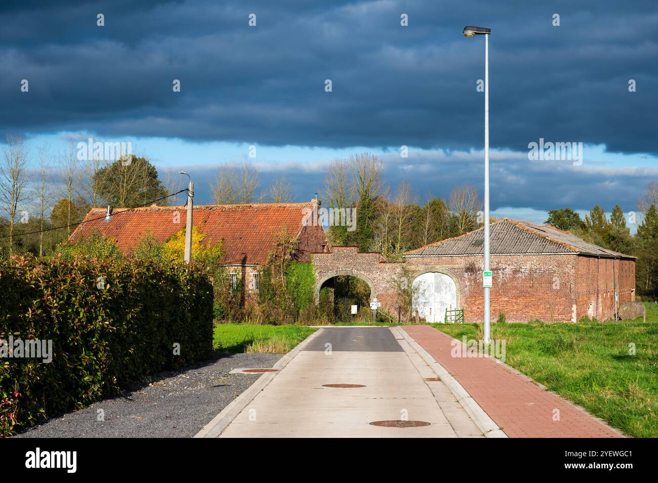 Perspective view over old brick stone farmhouse at the Flemish ...