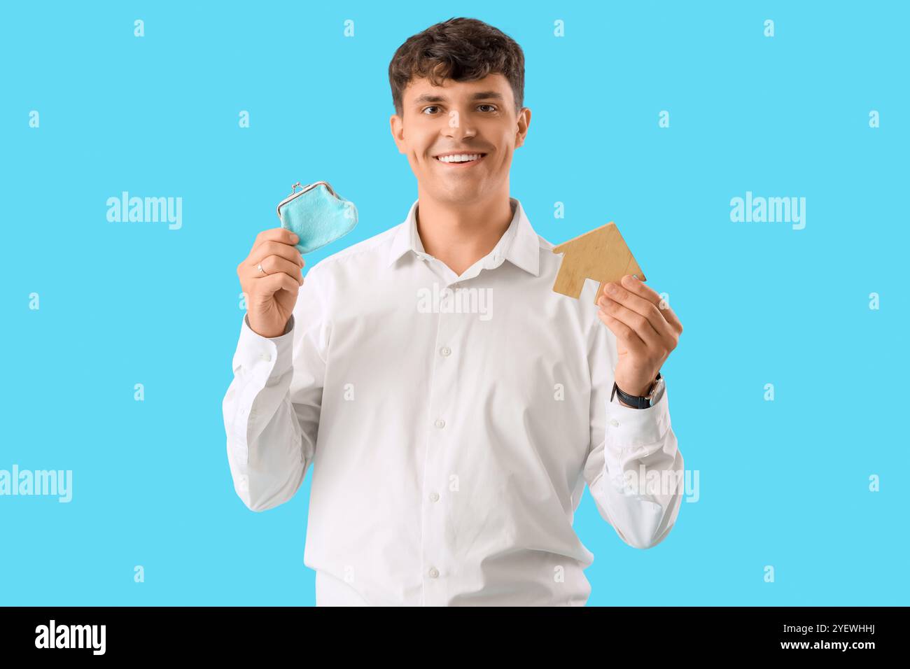 Male real estate agent with wallet and house figure on blue background ...