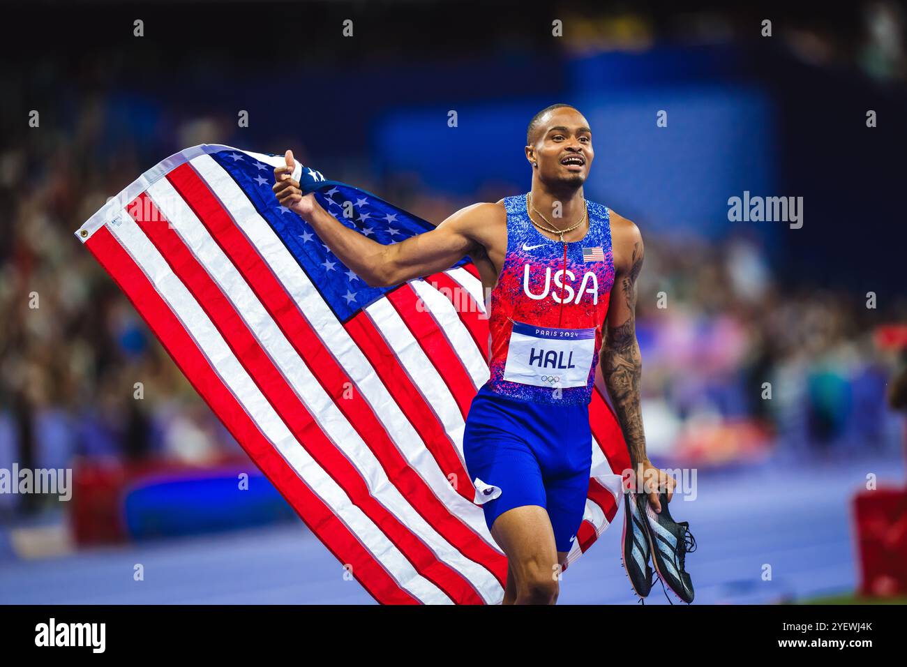 Quincy Hall celebrating her victory with her country's flag at the ...