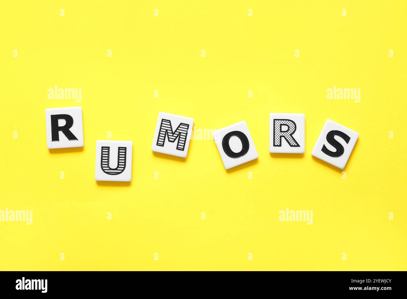Word RUMORS on yellow background. Gossip concept Stock Photo - Alamy