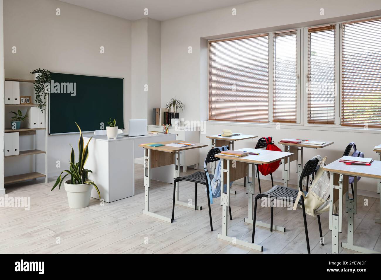 Interior of empty classroom with school desks and greenboard Stock ...