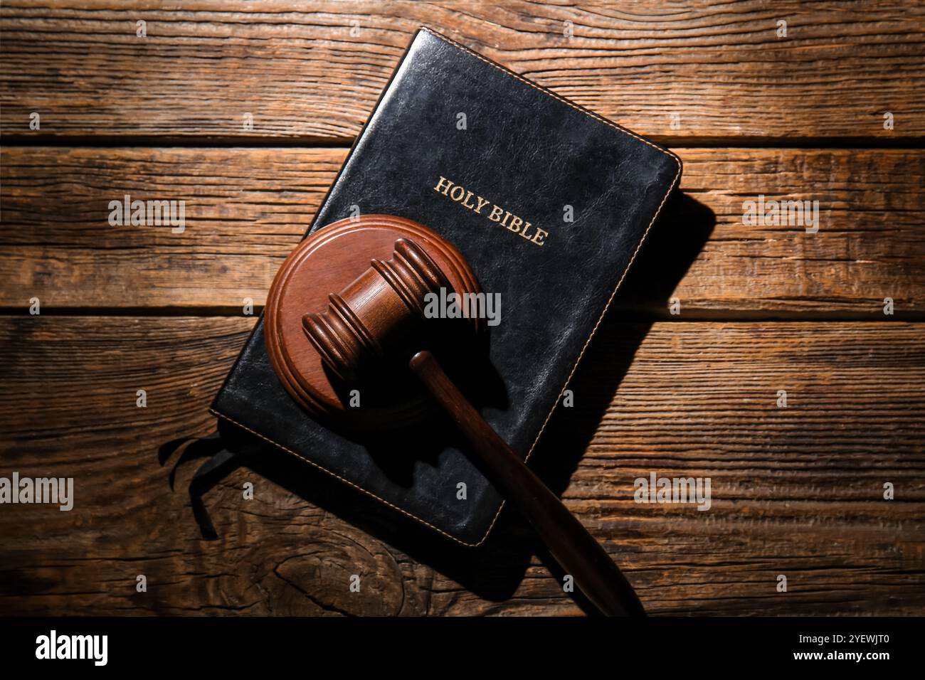 Holy Bible with judge's gavel on dark wooden background Stock Photo - Alamy
