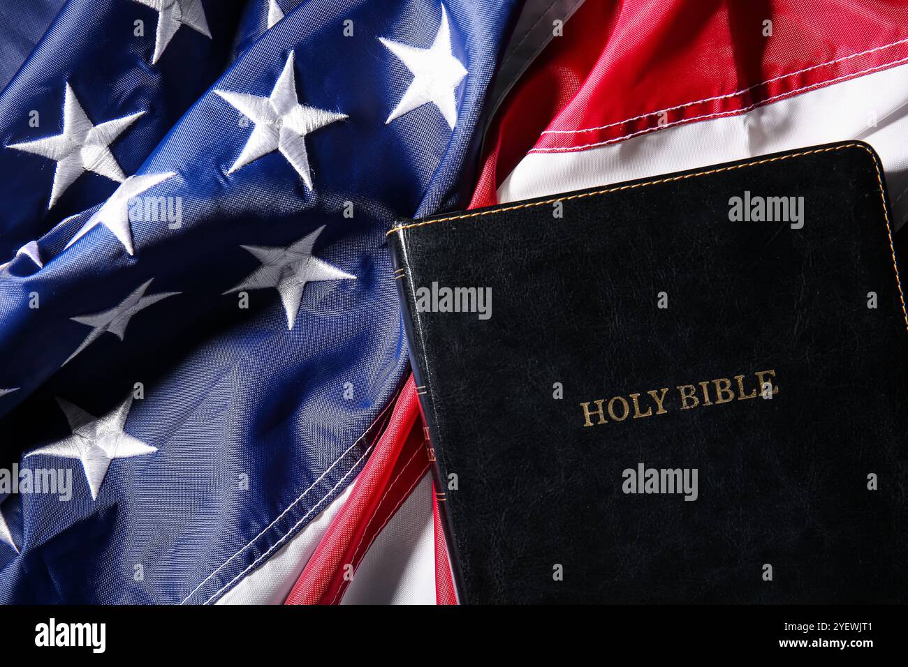 Holy Bible on USA flag, closeup Stock Photo - Alamy