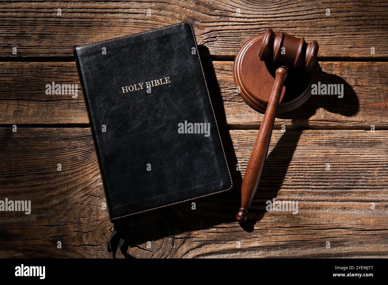 Holy Bible with judge's gavel on dark wooden background Stock Photo - Alamy
