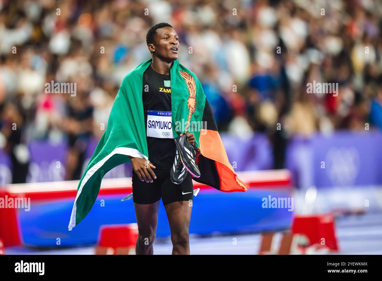 Muzala Samukonga celebrating her victory with her country's flag at the ...