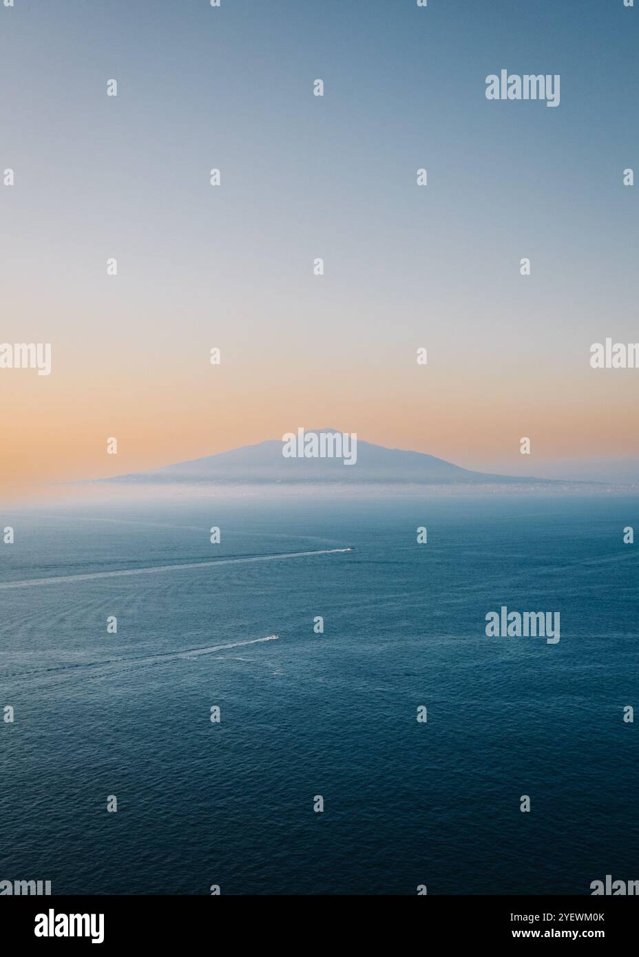 View of Mount Vesuvius Across the Tranquil Mediterranean Sea at Sunset ...