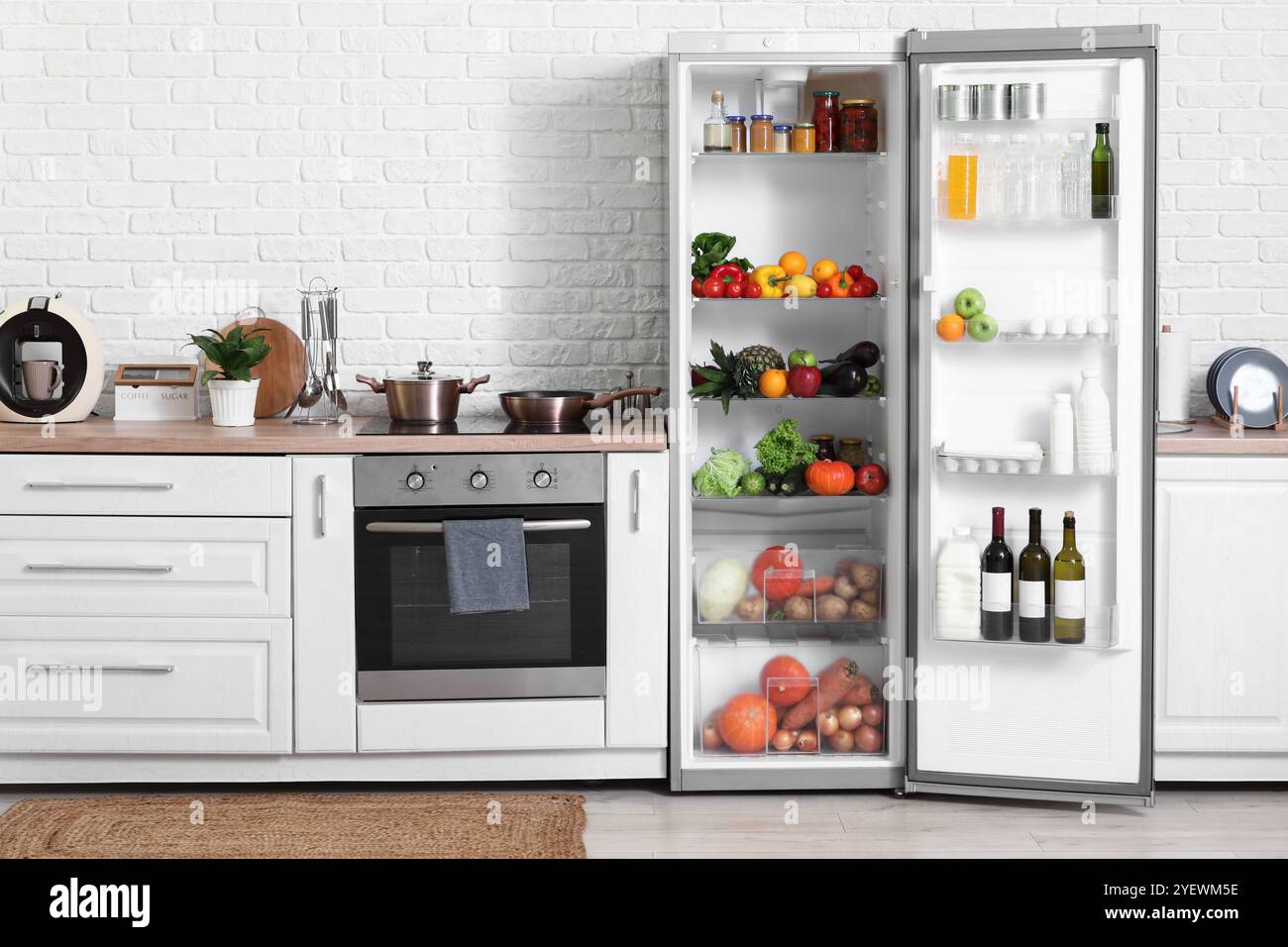 Big open fridge with different fresh products in modern kitchen Stock ...