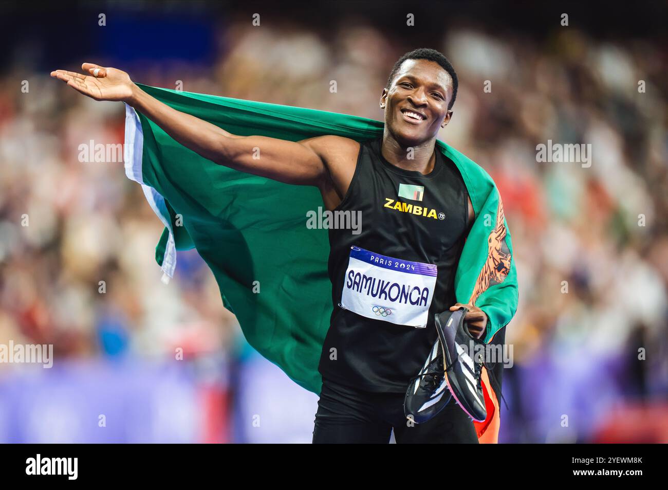 Muzala Samukonga celebrating her victory with her country's flag at the ...