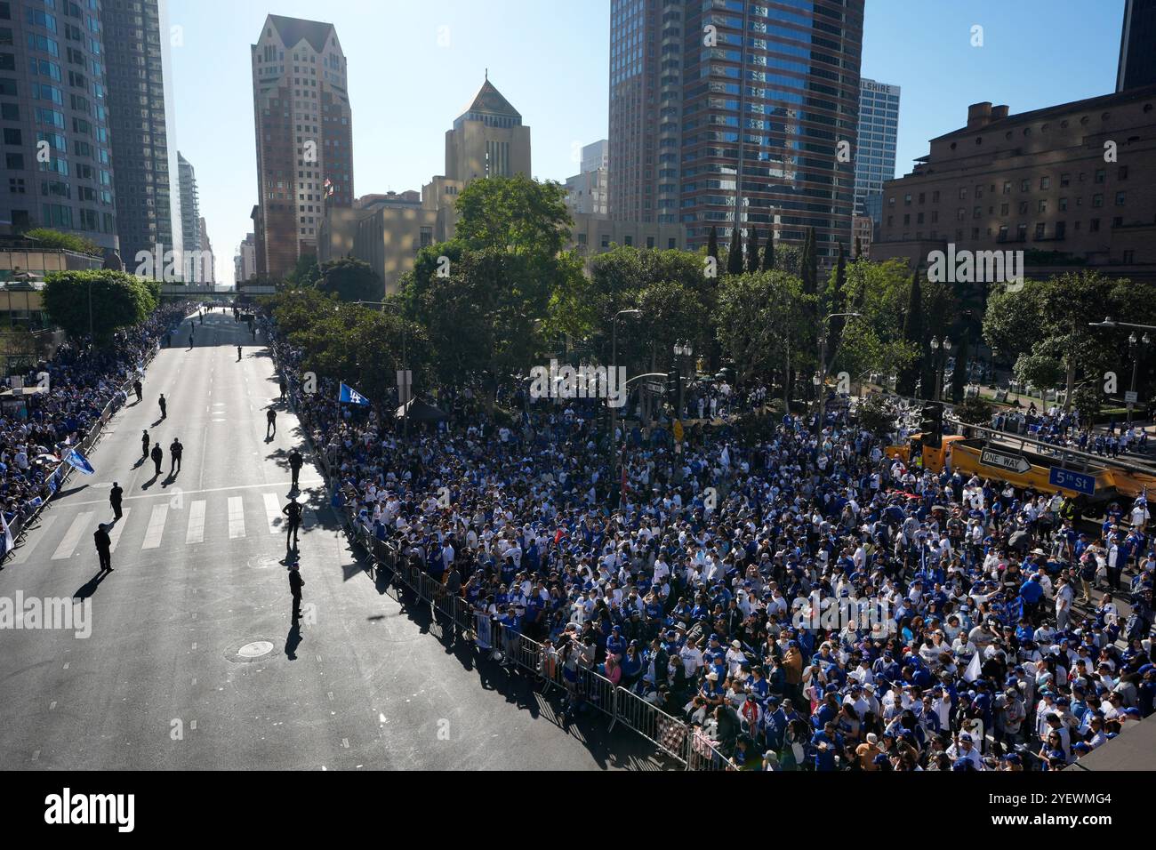 Fans crowd the sidewalks as they await the start of the Los Angeles ...