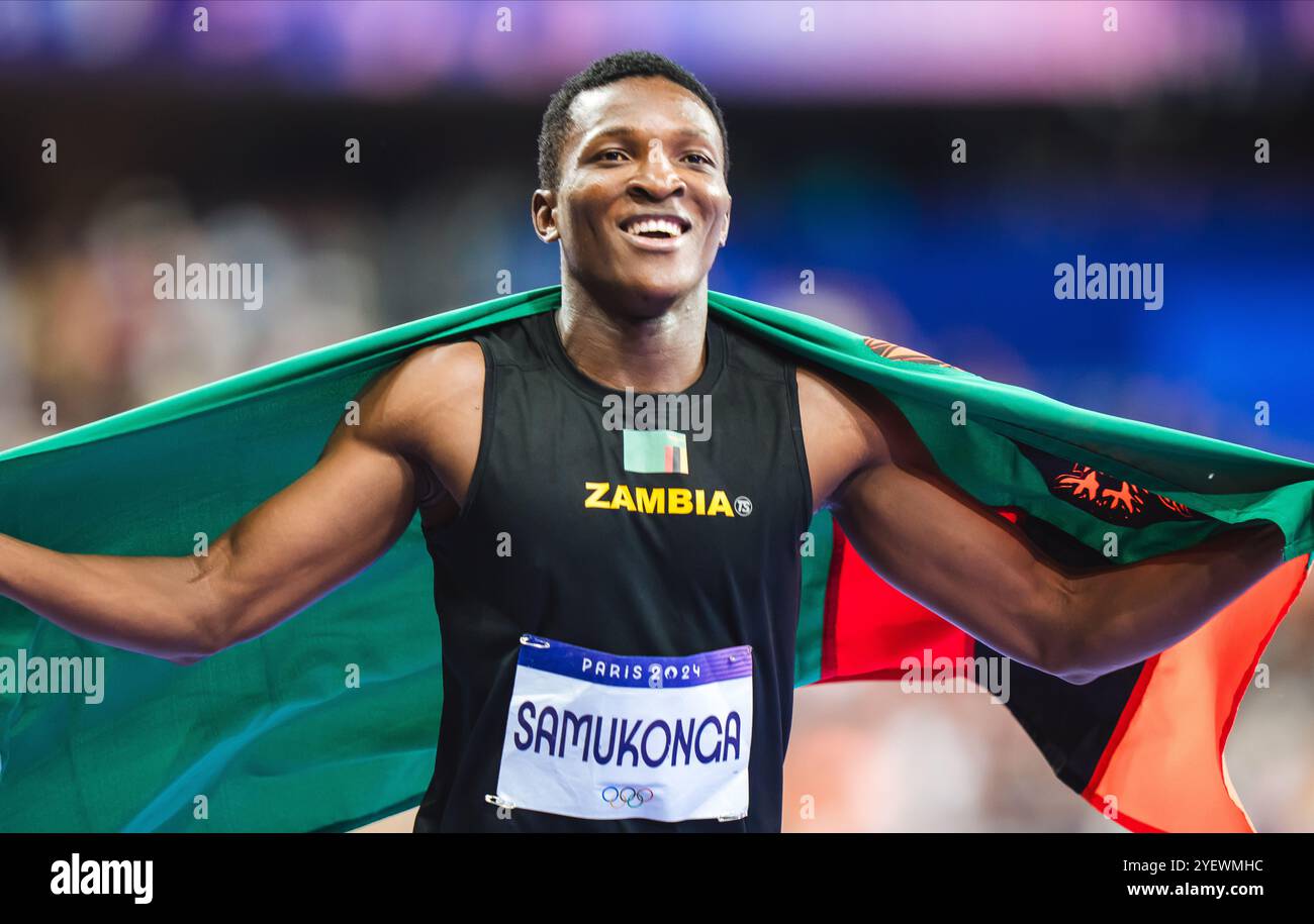 Muzala Samukonga celebrating her victory with her country's flag at the ...