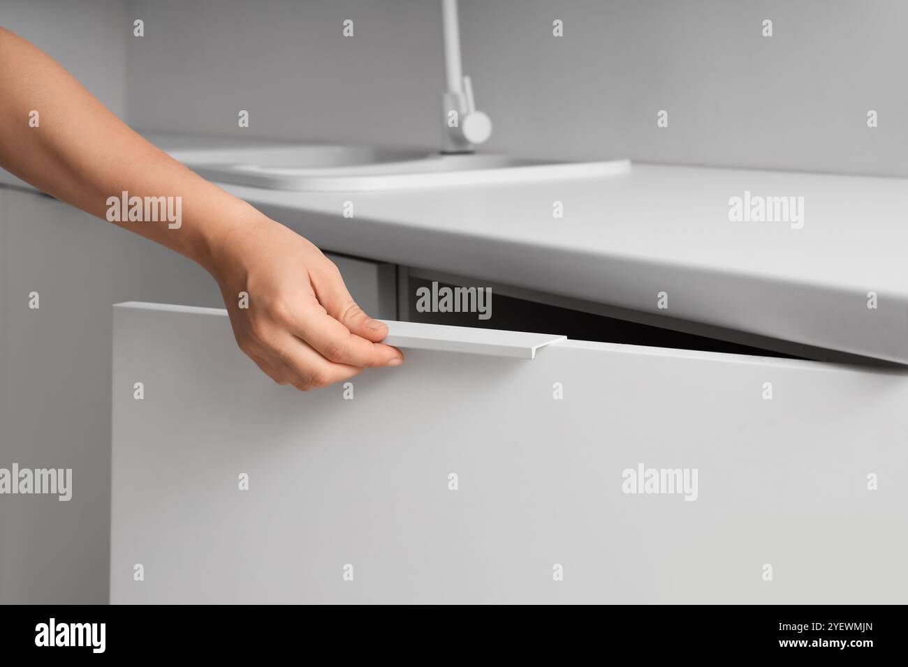 Hand opening drawer in hi-res stock photography and images - Alamy