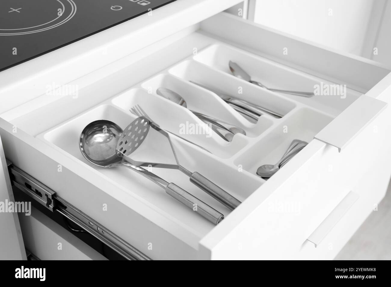 Open drawer with utensils in kitchen, closeup Stock Photo - Alamy