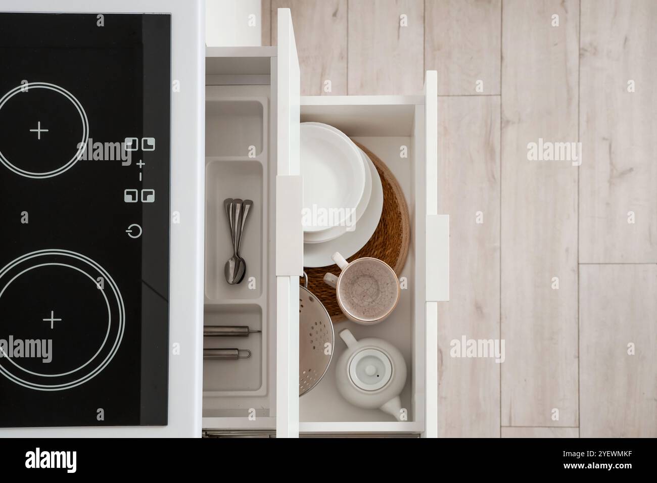 Open drawer with dishes in kitchen, top view Stock Photo - Alamy