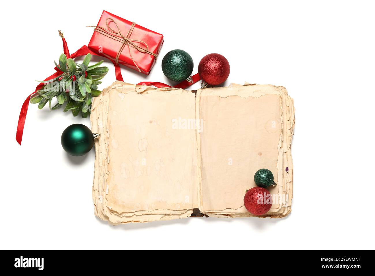 Composition with old open book, Christmas decorations and gift box on ...