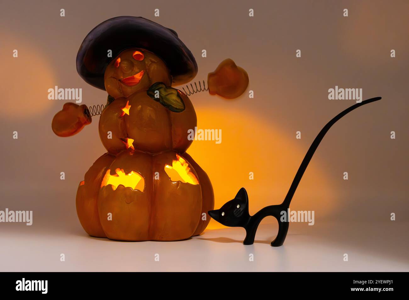 Jack O Lantern and and a black cat figurine. Ceramic candle holder in ...
