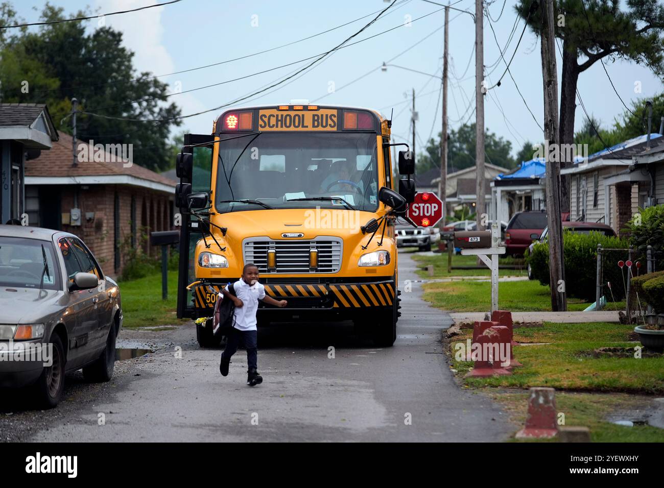 DeAnthony Nabor, 6, runs home from the school bus in the Elkinsville ...