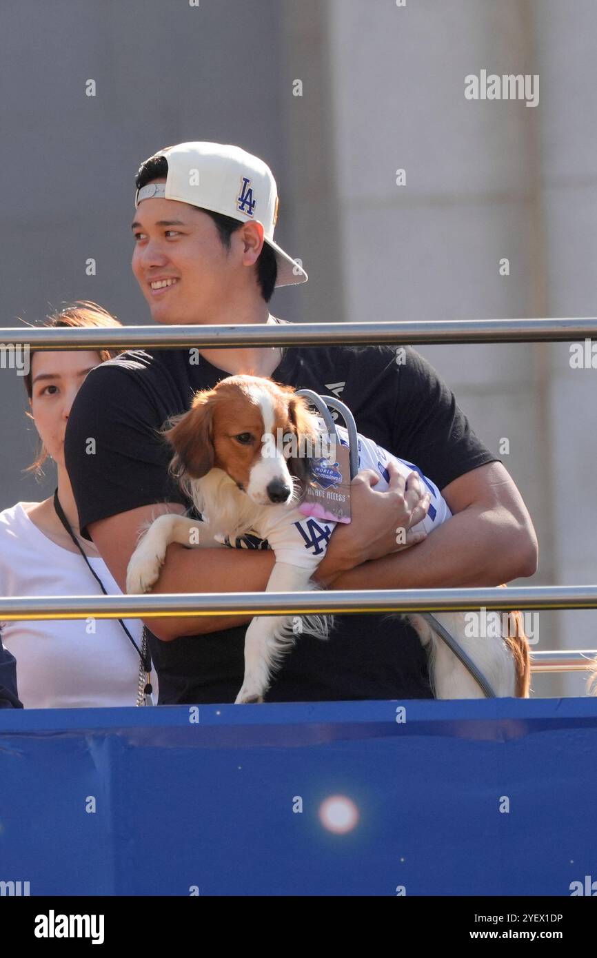 Los Angeles Dodgers' Shohei Ohtani holds his dog Decoy during the Los Angeles Dodgers baseball ...