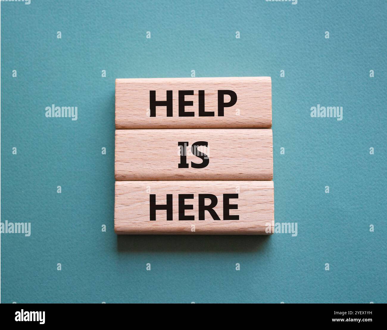 Help is here symbol. Wooden blocks with words Help is here. Beautiful ...