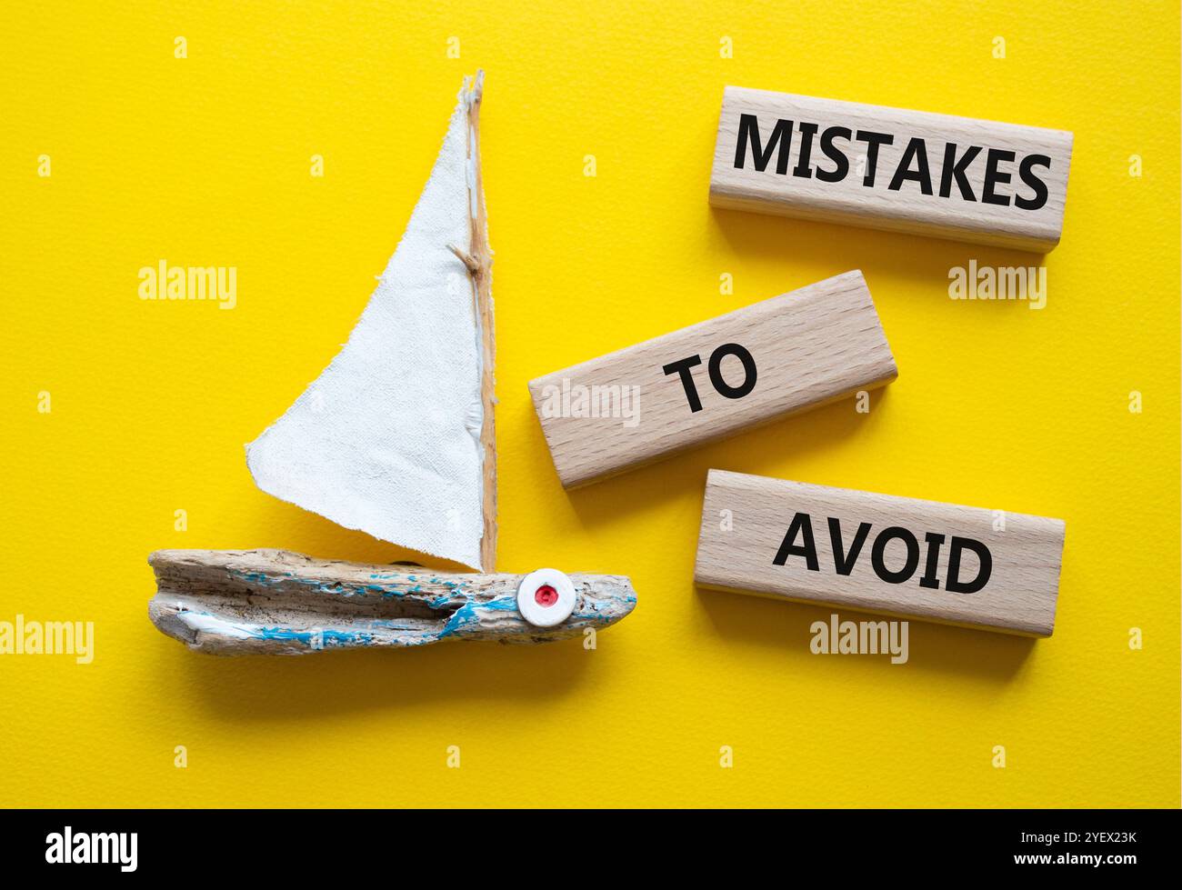 Mistakes to Avoid symbol. Wooden blocks with words Mistakes to Avoid ...