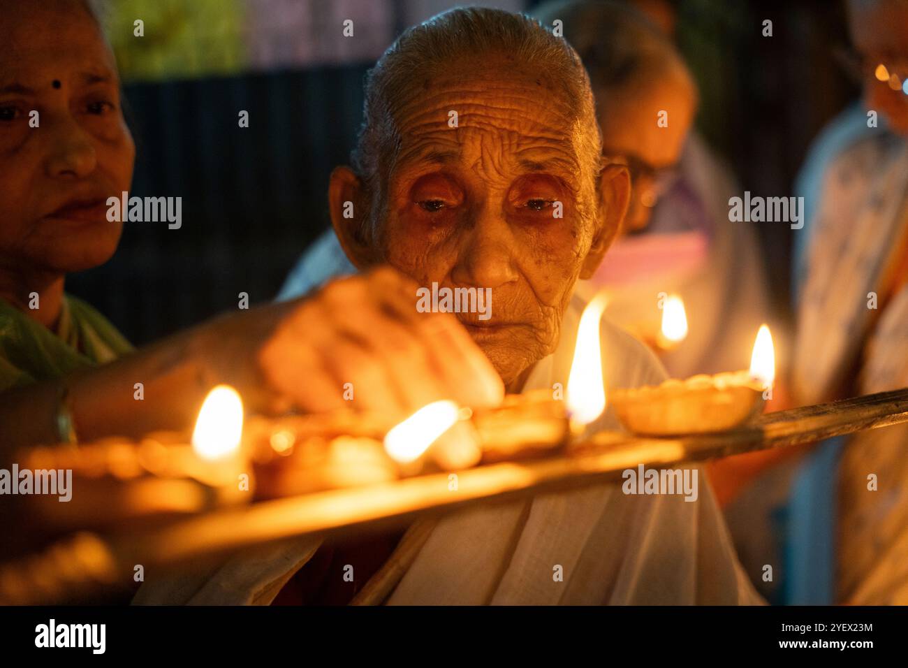 Elderly women of Pramod Talukdar Memorial Old Age Home light Diya oil ...