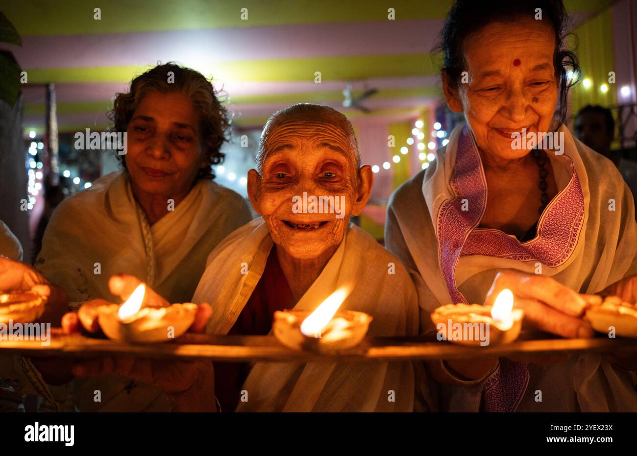 Elderly women of Pramod Talukdar Memorial Old Age Home light Diya oil ...