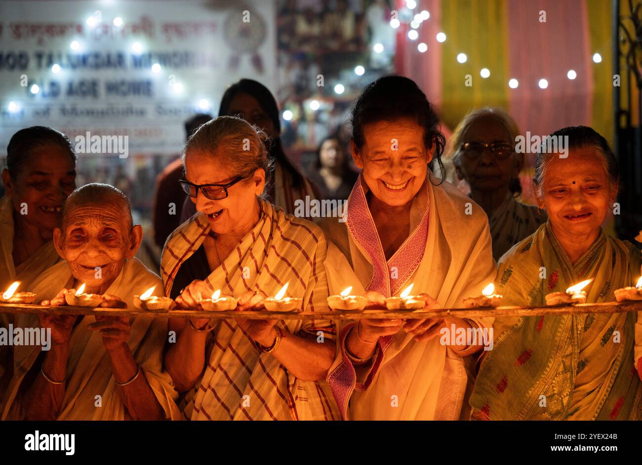 Elderly women of Pramod Talukdar Memorial Old Age Home light Diya oil ...