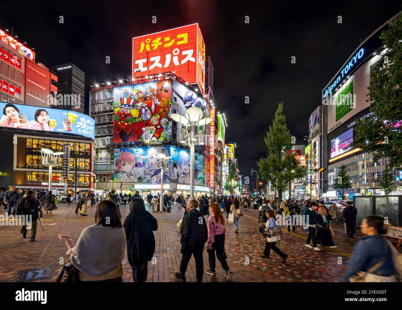 Crowded Kabukicho district at night with brightly lit buildings and ...