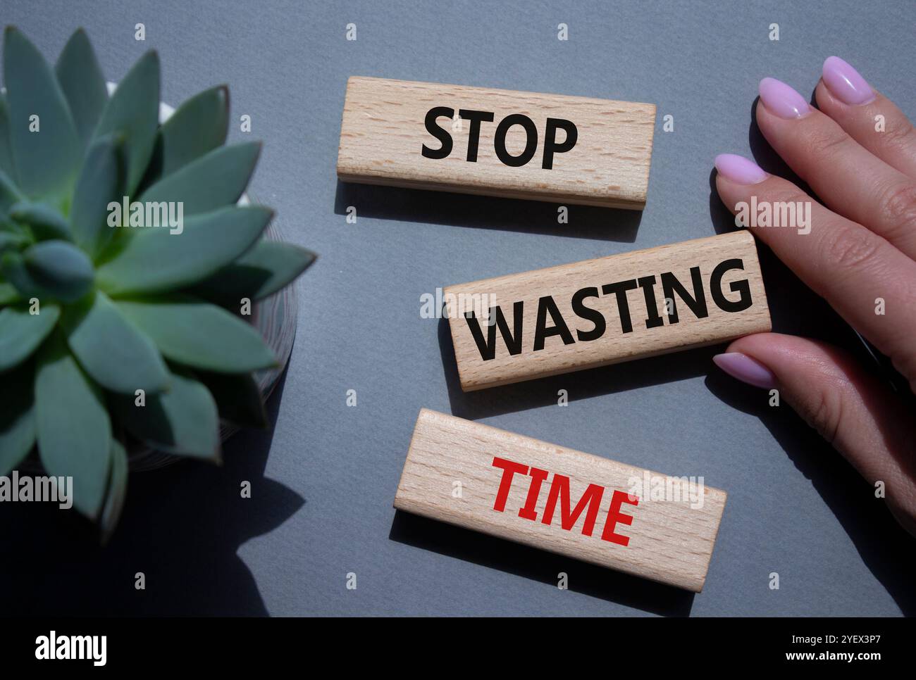 Stop Wasting Time symbol. Wooden blocks with words Stop Wasting Time ...