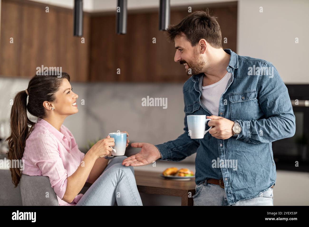 Two friends share a warm and friendly conversation while enjoying ...