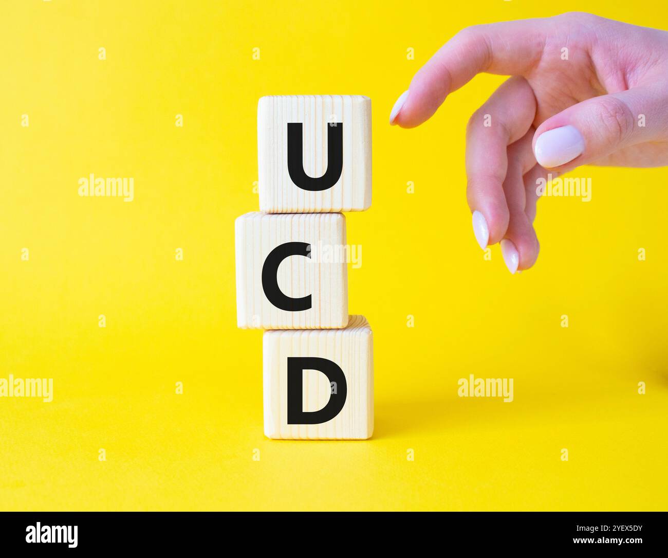 UCD - User Centered Design. Wooden cubes with word UCD. Businessman ... UCD - User Centered Design. Wooden cubes with word UCD. Businessman ...