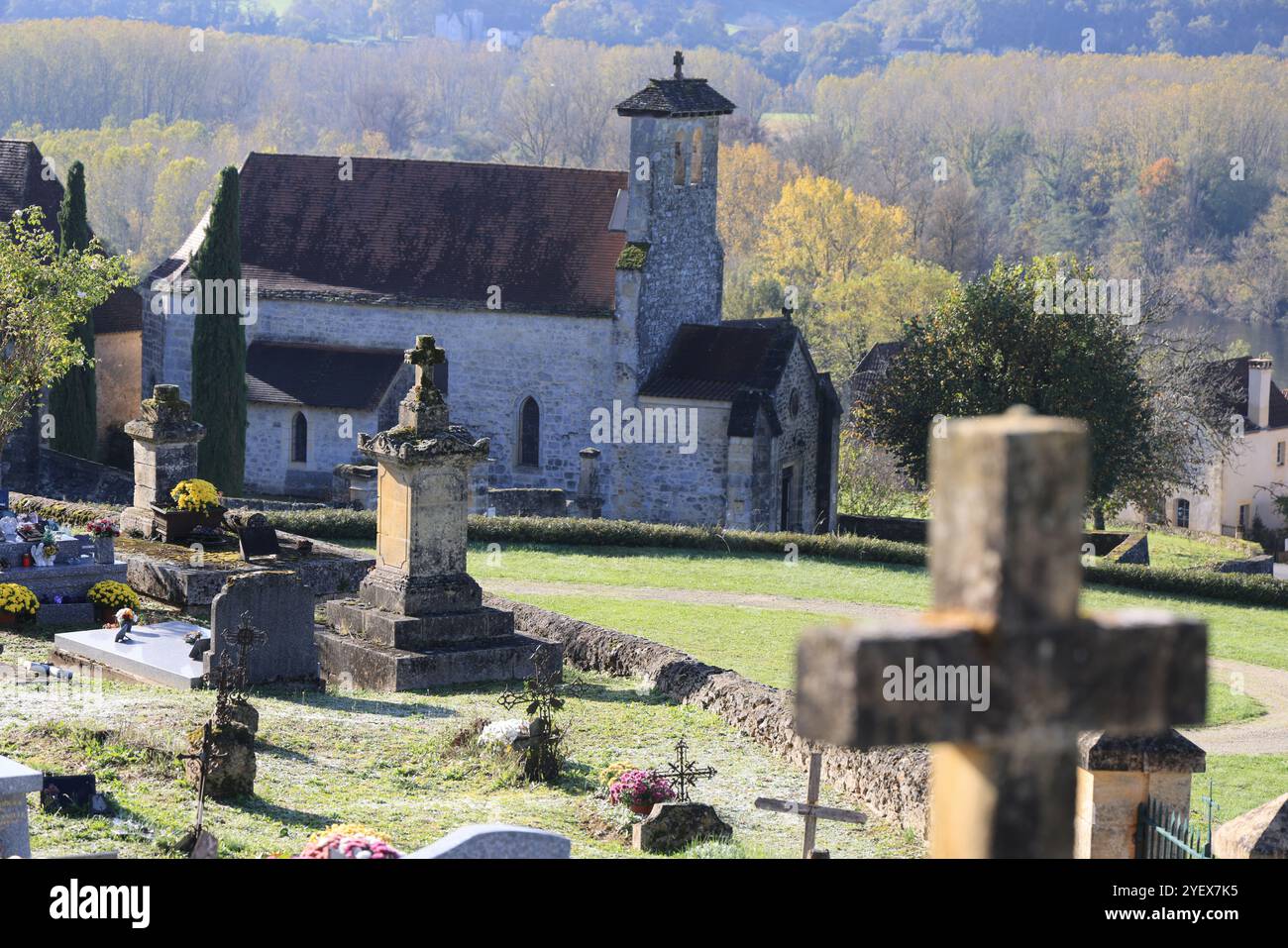 Countryside cemetery on All Saints' Day. Worship and memory of the dead ...