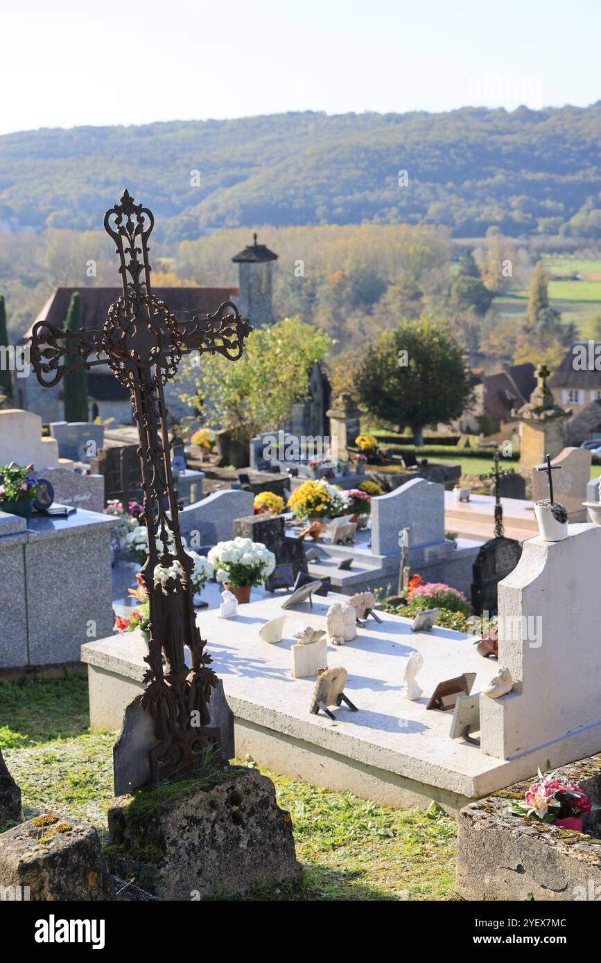 Countryside cemetery on All Saints' Day. Worship and memory of the dead ...