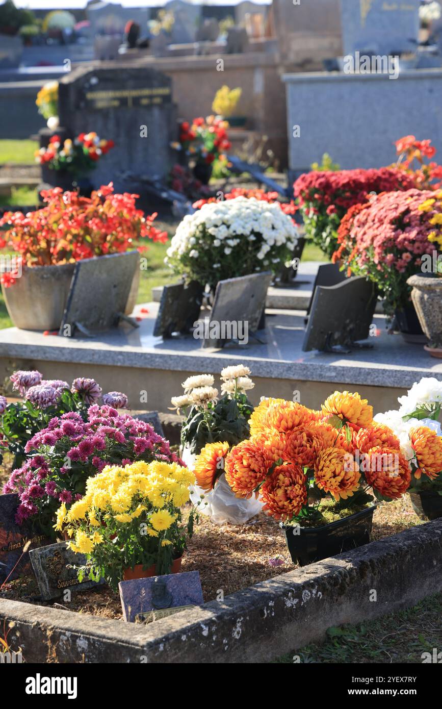 Countryside cemetery on All Saints' Day. Worship and memory of the dead ...