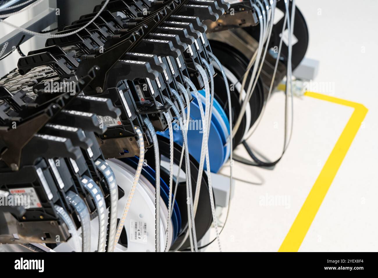 Electronics SMT reel components and feeders on the assembly line Stock ...