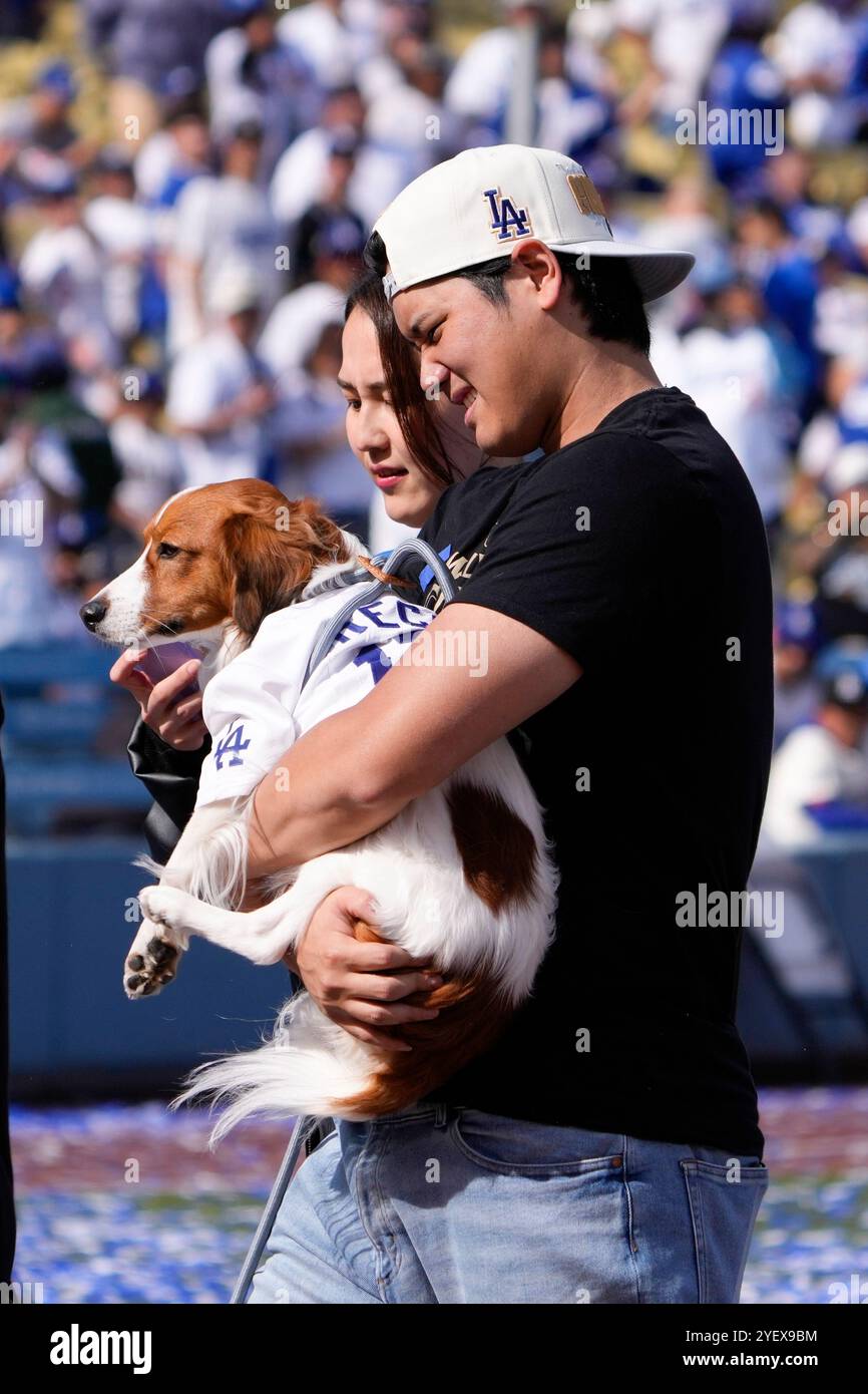 Los Angeles Dodgers' Shohei Ohtani holds his dog Decoy during the baseball team's World Series ...