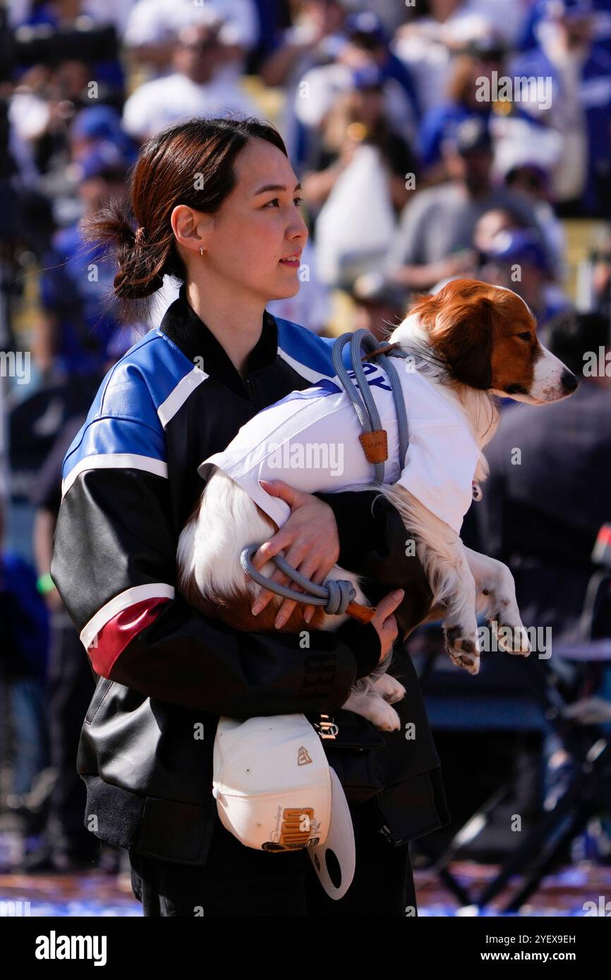 Mamiko Tanaka, wife of Los Angeles Dodgers' Shohei Ohtani, holds their dog Decoy during the ...