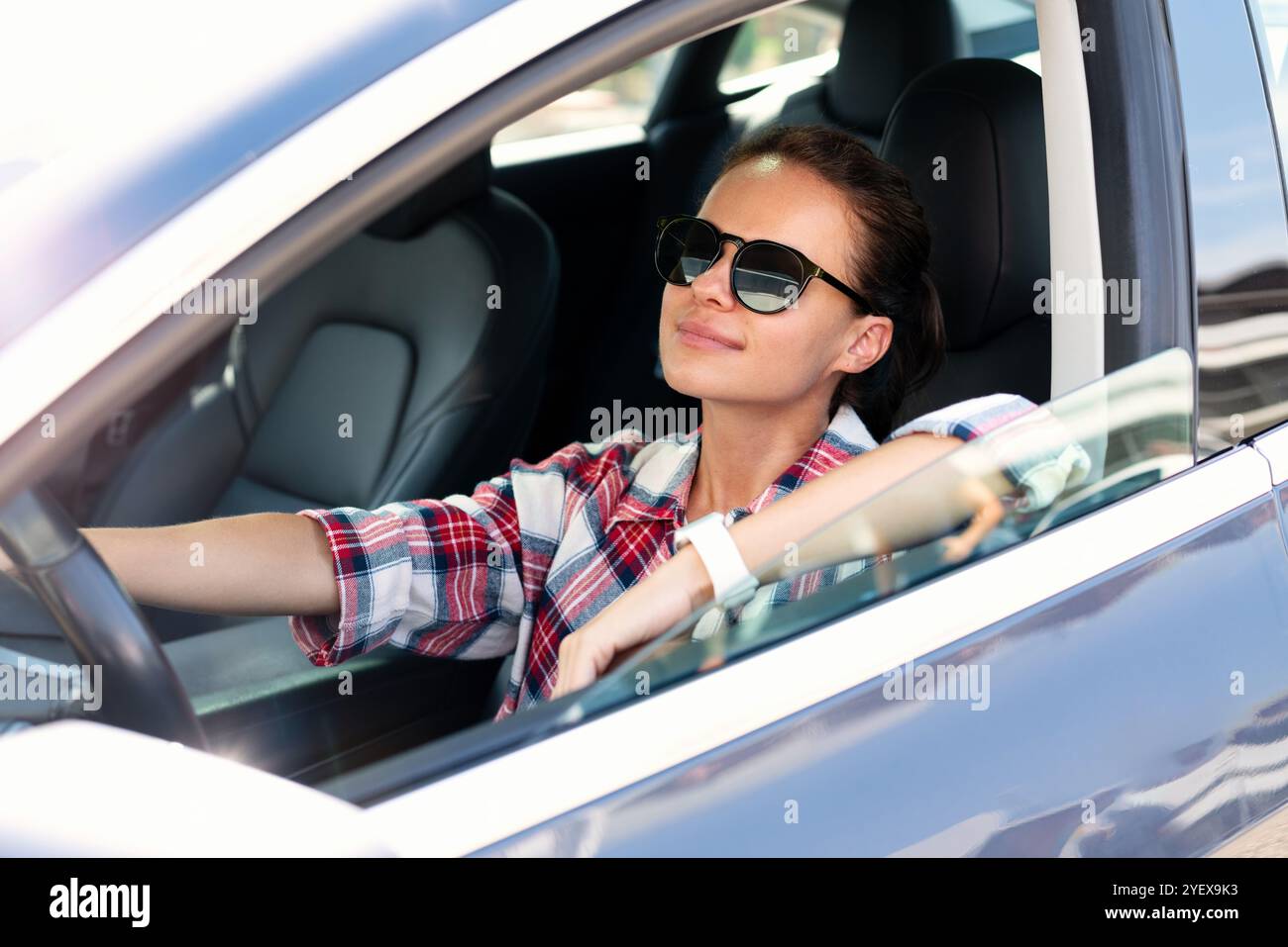 Woman driving car sunglasses hi-res stock photography and images - Alamy