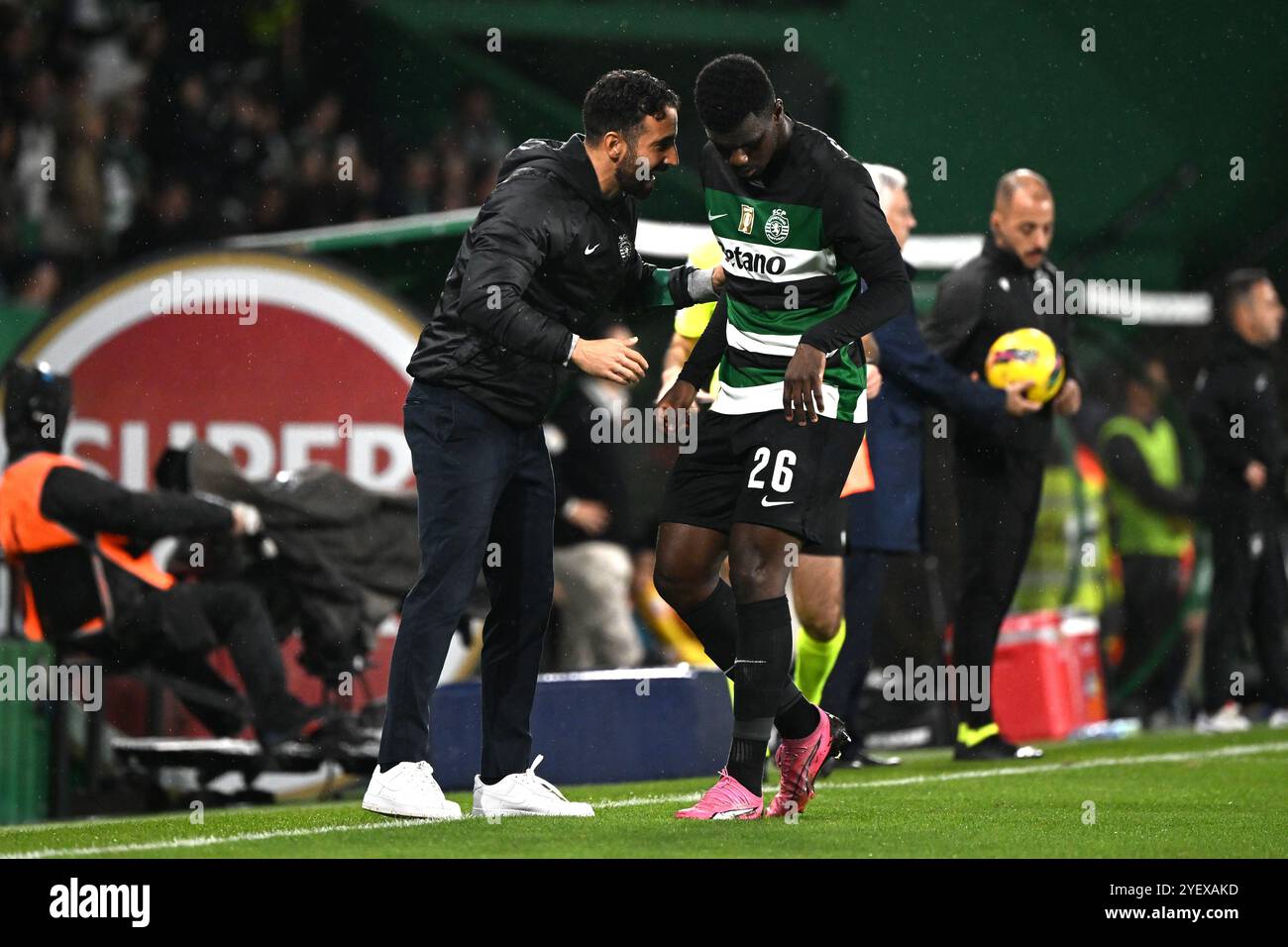 Sporting CP manager Ruben Amorim speaks with player Ousmane Diomande ...