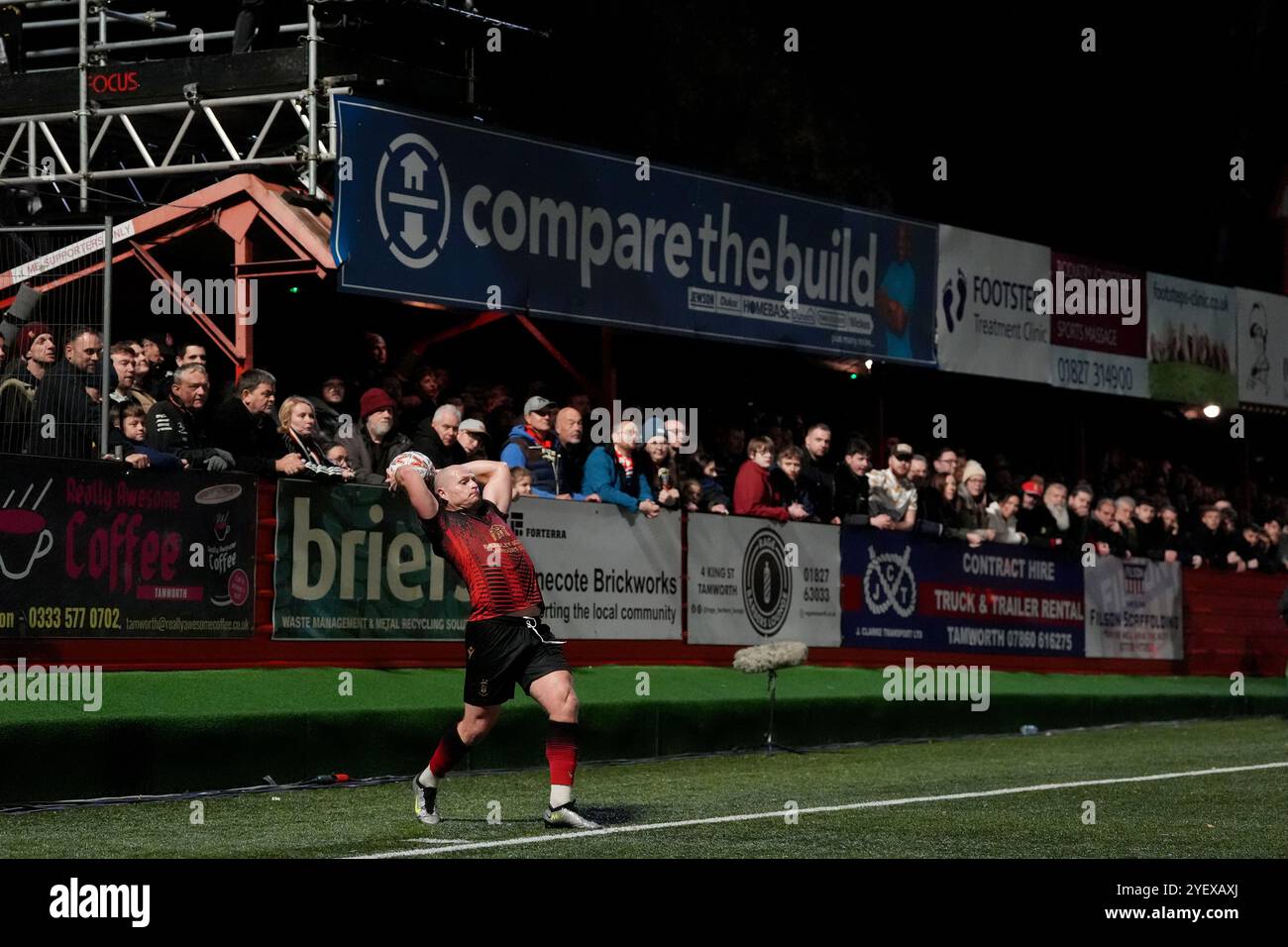 Tamworth's Tom Tonks takes a throw in leading to the opening goal ...