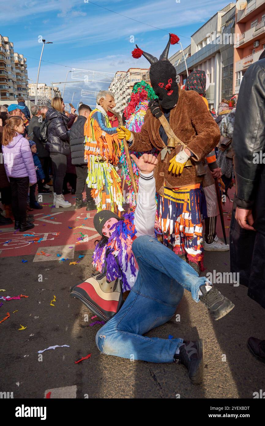 Bacau, Romania, December 2023, people dressed in impressive masks and ...