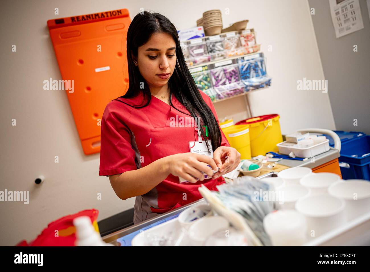 Berlin, Germany. 31st Oct, 2024. Teyssir Ben Rejeb, nurse, prepares ...