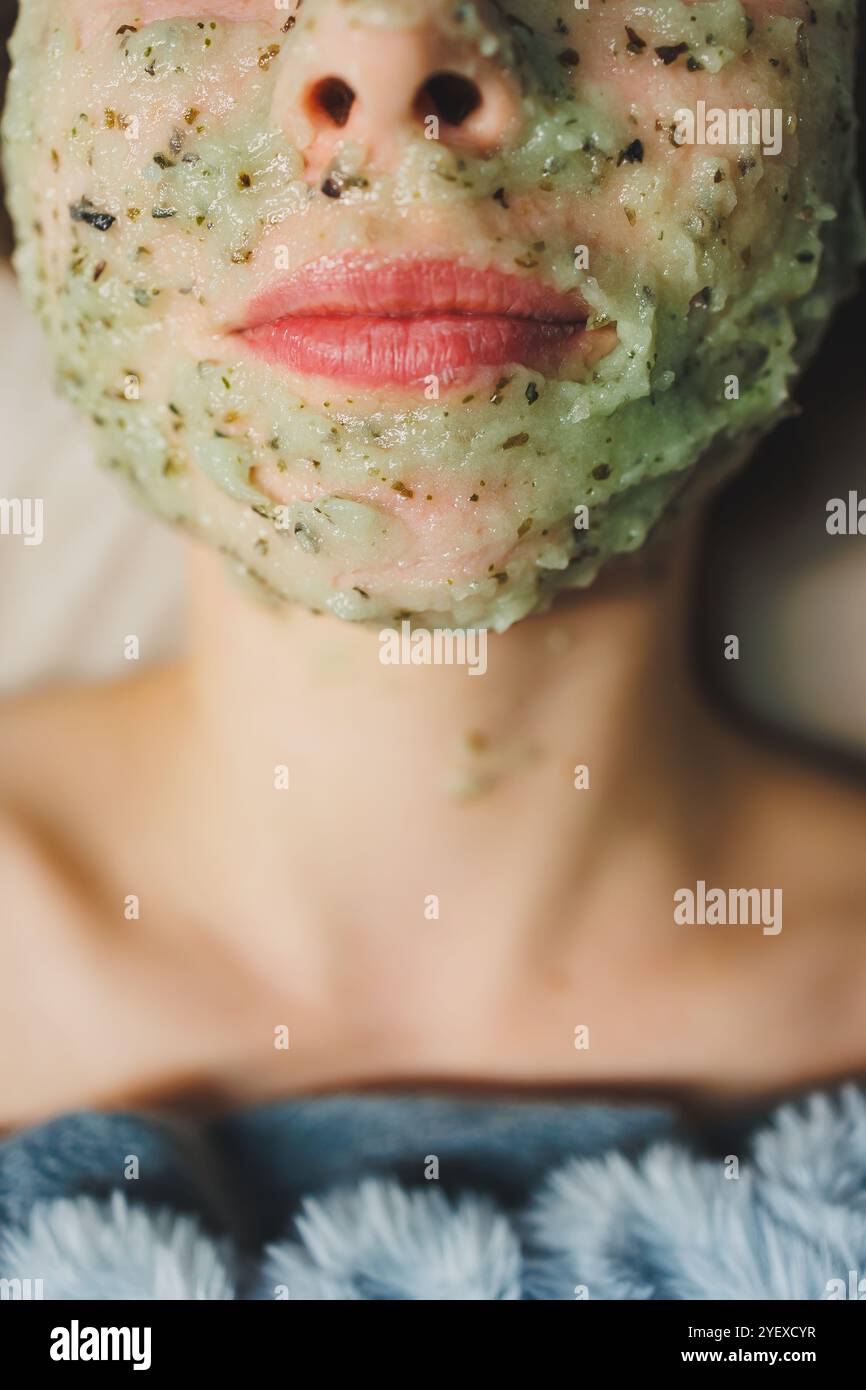Facial skin care. A woman's face with an organic mask to moisturize the ...