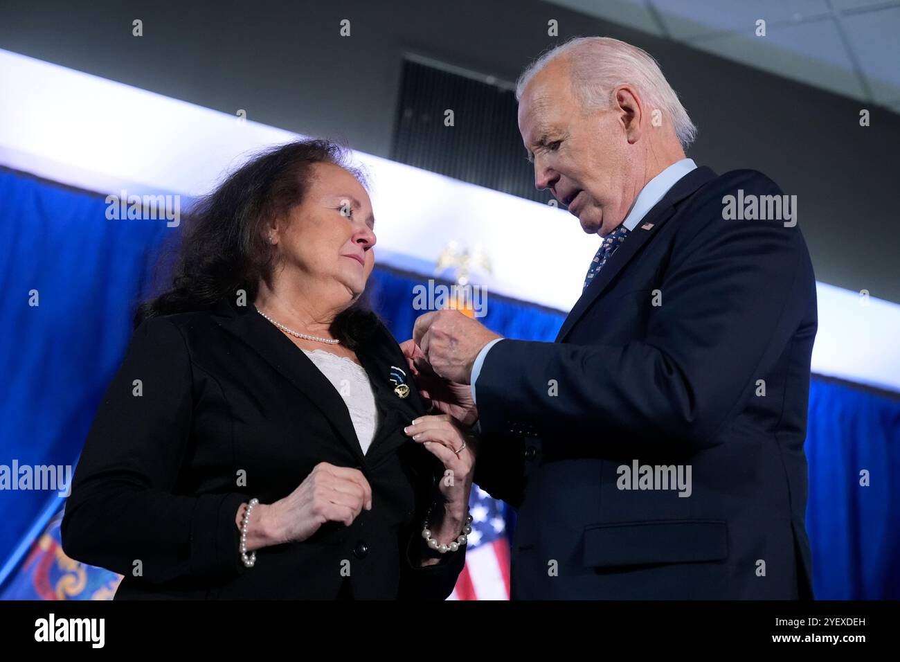 Butch Lewis' widow, Rita Lewis, left, receives the Presidential ...
