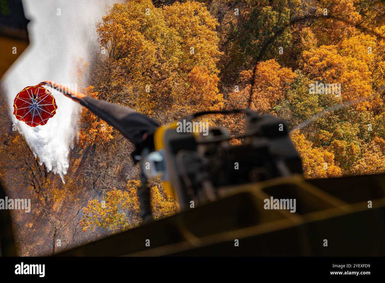 A helicopter bucket full of water, sling loaded by a Connecticut Army ...