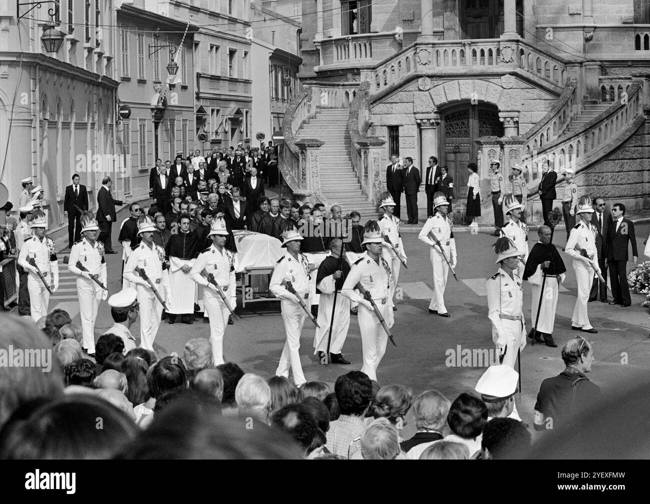 With an escort of guards carrying their rifles down, the funeral ...