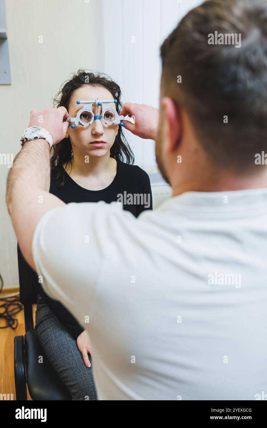 Eye examination of a young woman at an ophthalmologist's appointment ...