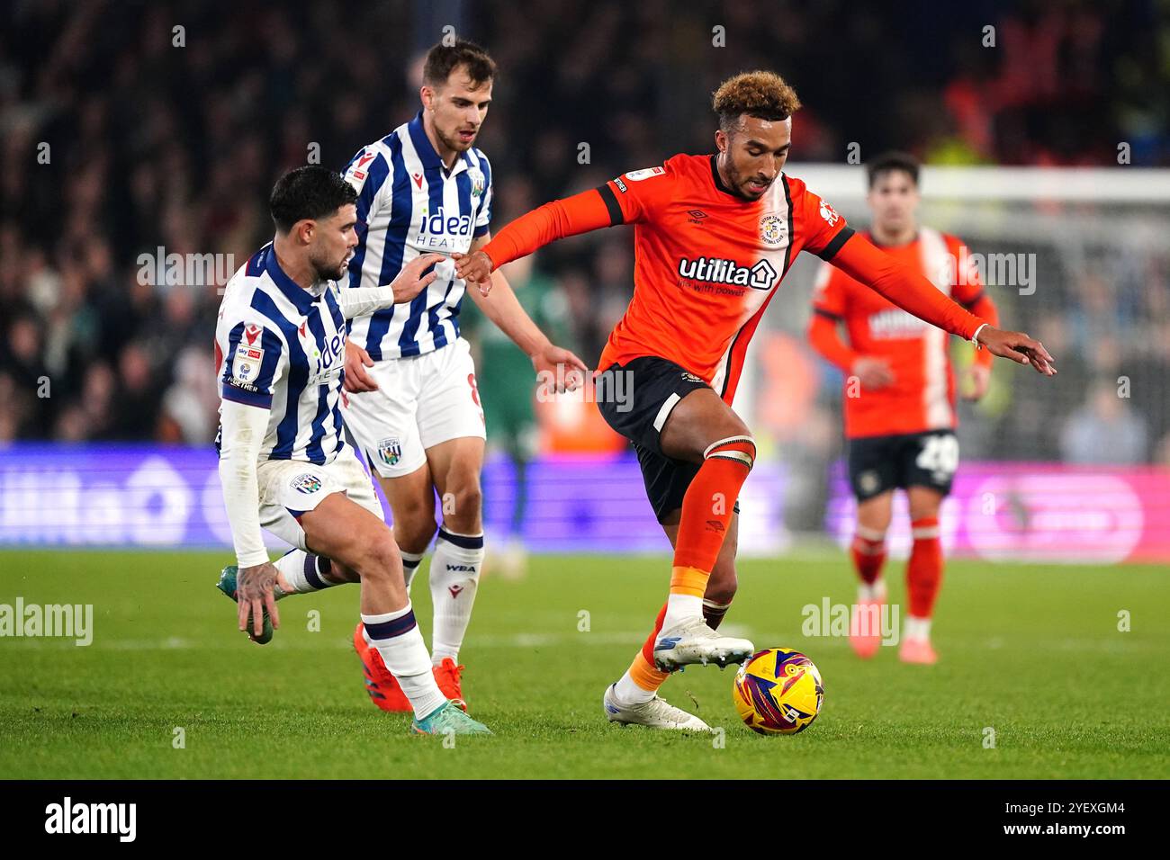 Luton Town's Jacob Brown (right) in action during the Sky Bet ...