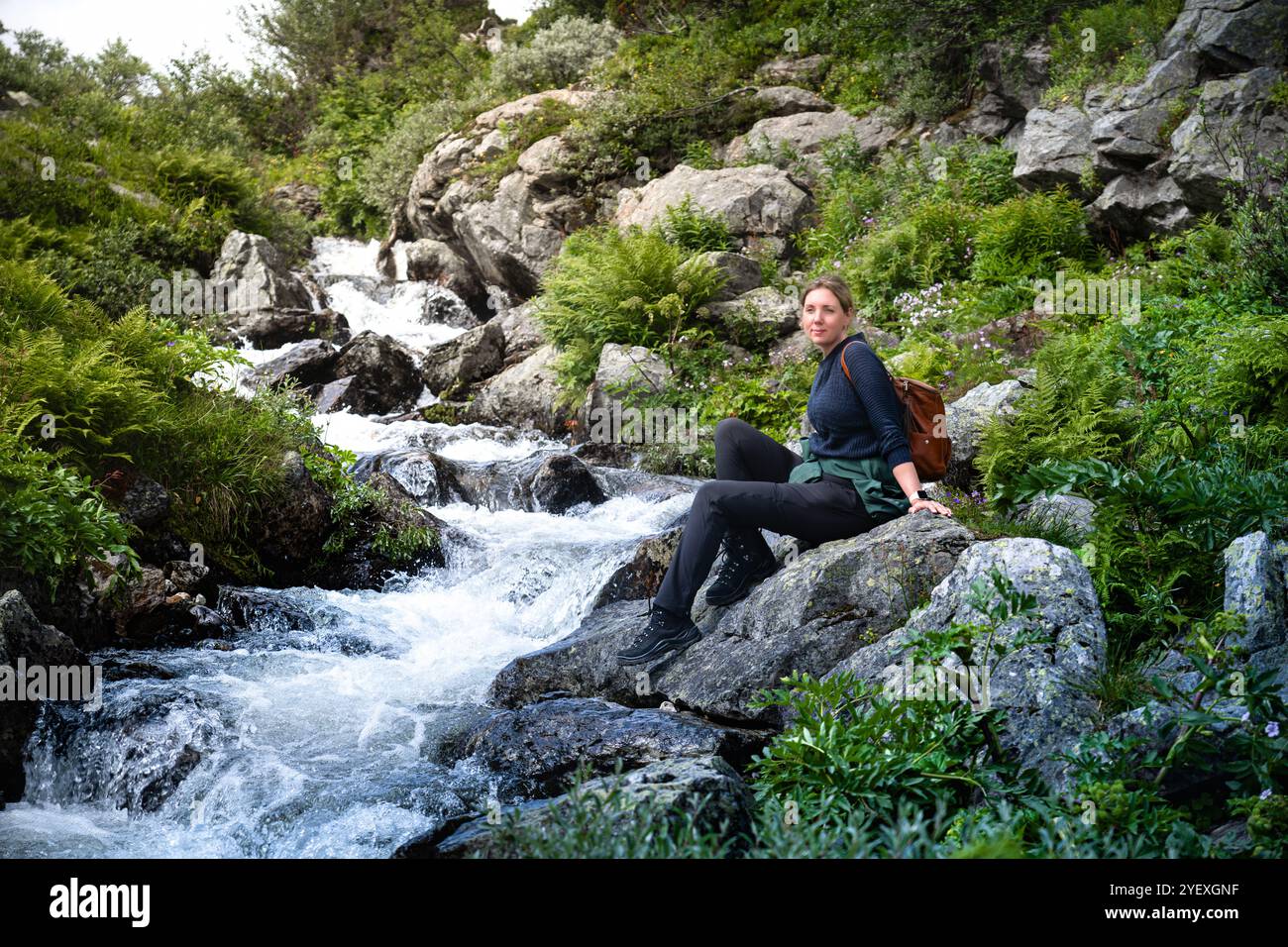 Woman taking a break and enjoying the scenic view hi-res stock ...