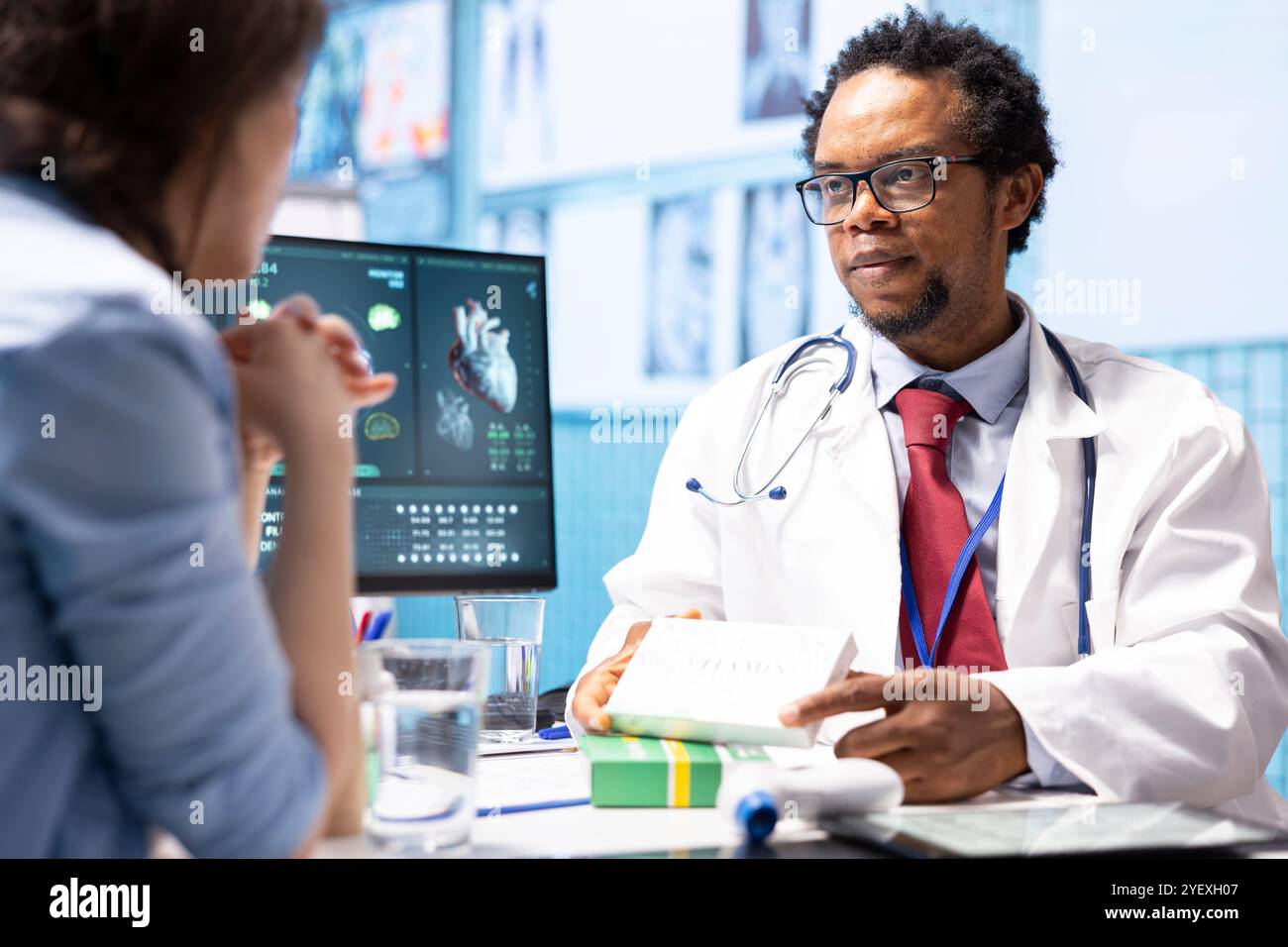 General practitioner recommending supplements and painkillers for a ...